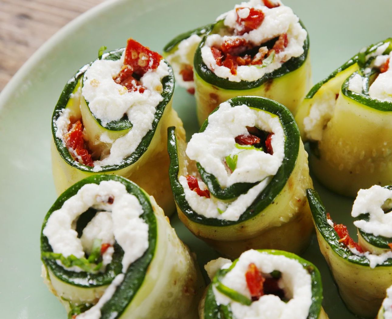 Zucchini roll ups with lemon ricotta and roasted pepper sauce